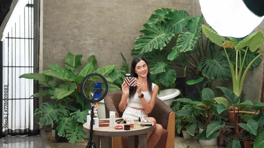 Beautiful content creator making natural beauty and cosmetic tutorial ...