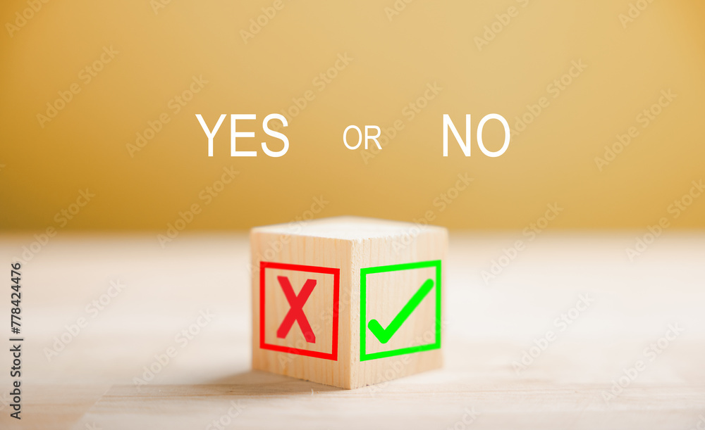 Green check mark and red x on wooden block signify decision making ...