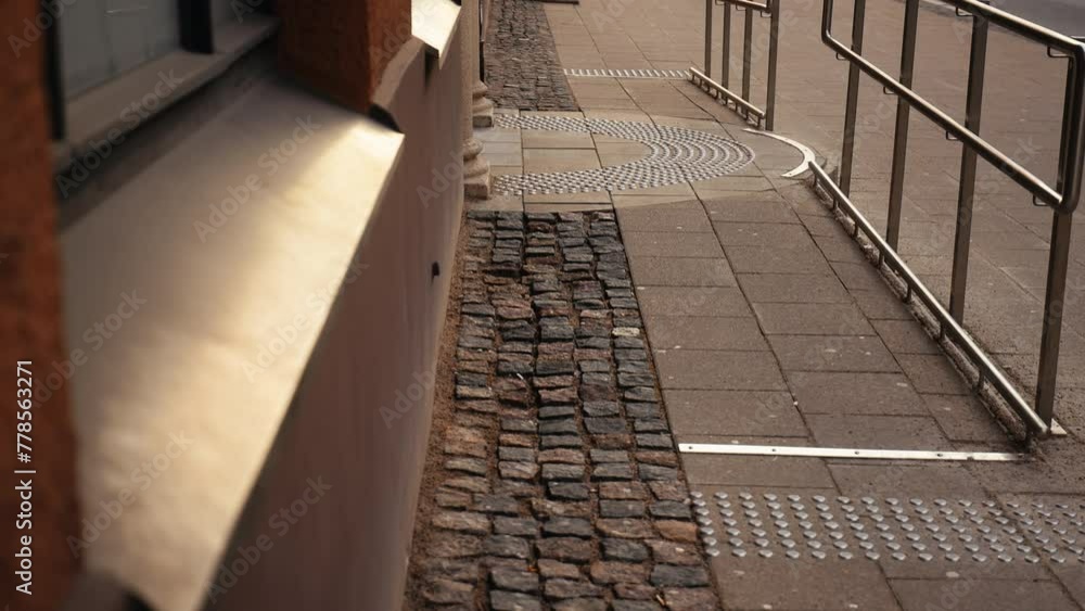Braille pathway: High-angle shot displaying tactile pavement with ...