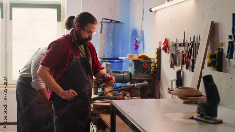 Vidéo Stock Woodworker using bench vise to hold lumber block, starting ...