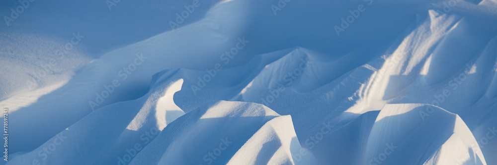 Snow texture. Wind sculpted patterns on snow surface. Wind in the ...