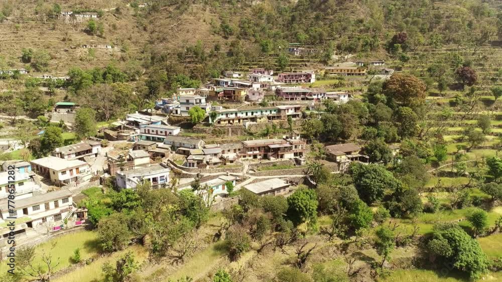 Drone shoot of a village in eastern India. Houses tops hills and the ...
