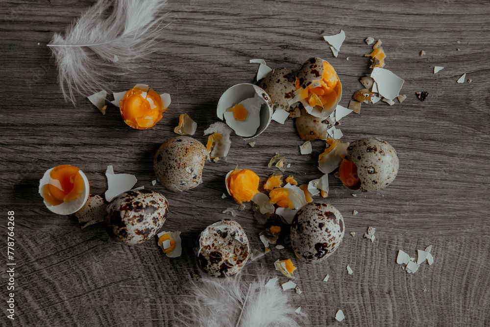 Cracked quail egg with broken shell in box on grey background Stock ...
