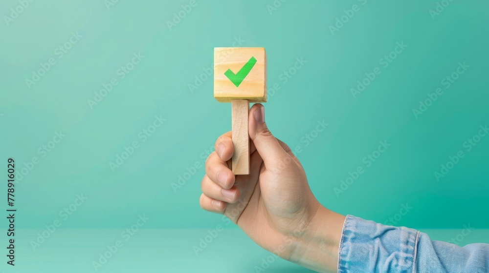 Hand holding wooden block with tick marks, good feedback rating and ...