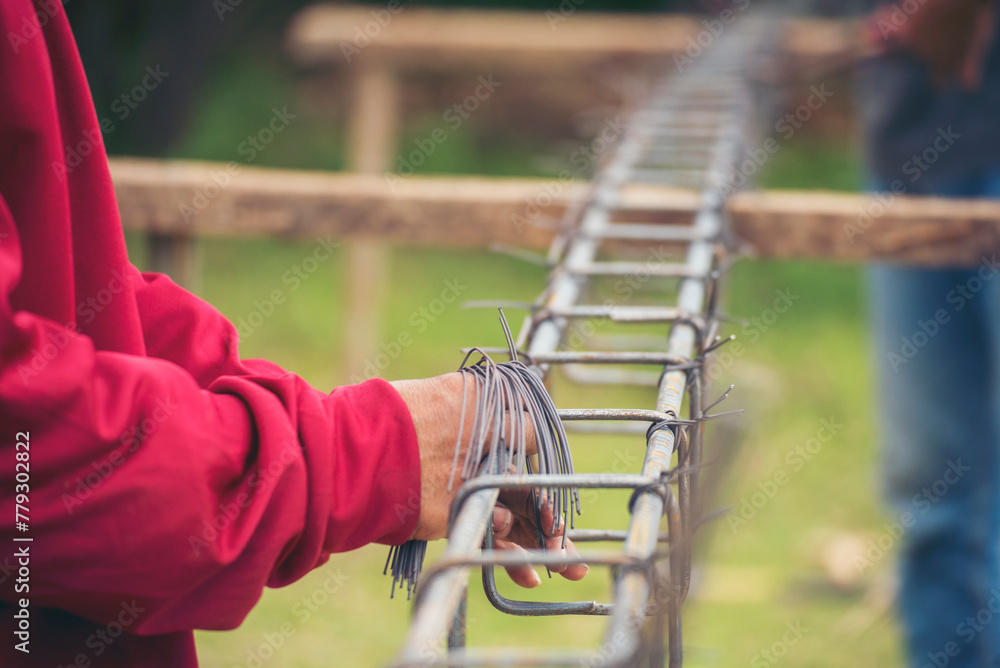 Construction Worker hands using pincer pliers iron wire. Outdoor Worker ...