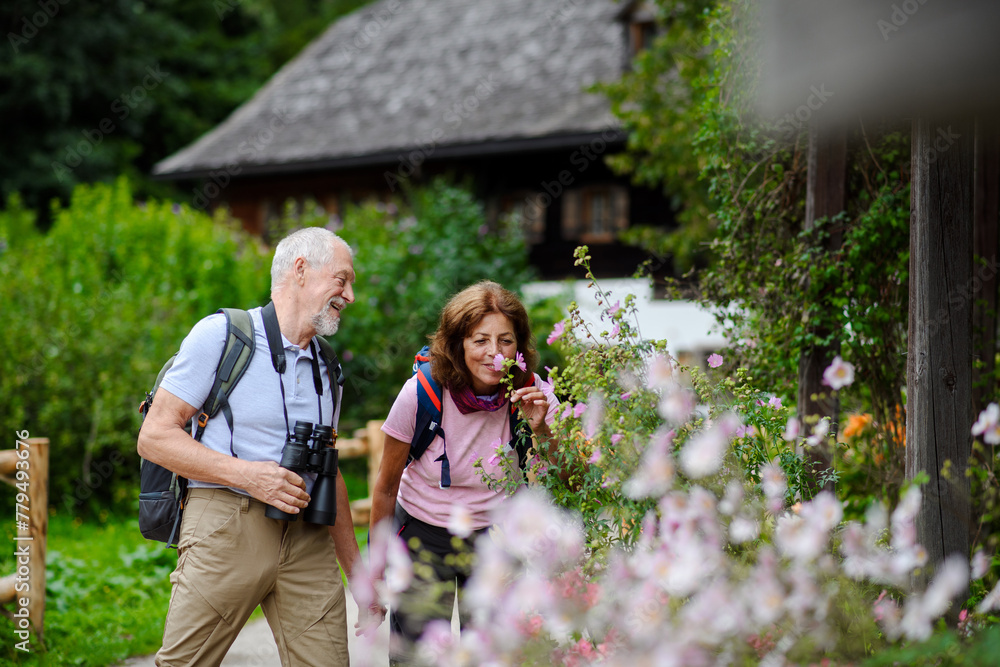 Active elderly couple on trip together, during spring day. Senior ...