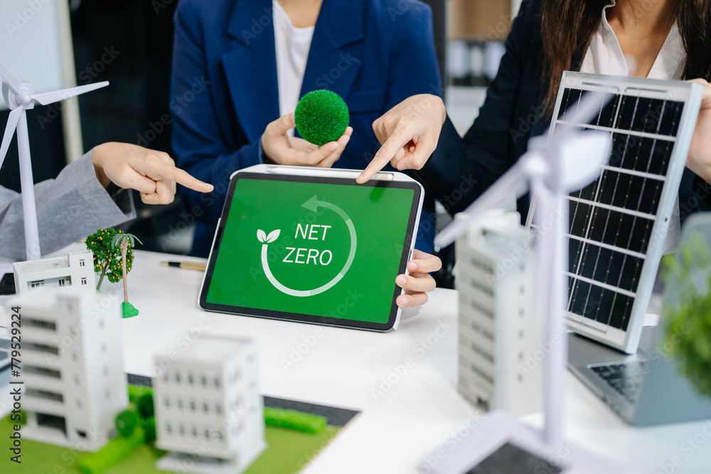 Business team people planning hand using laptop for working technology and business Net zero and ...