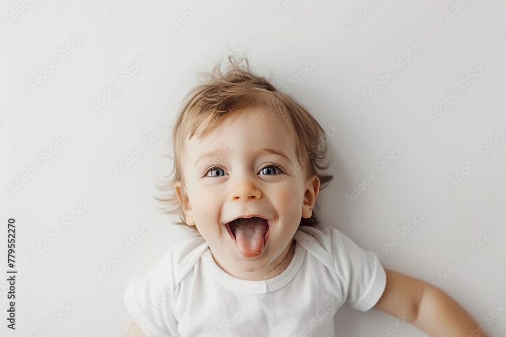 Cute and playful portrait of happy 1 years old child playing on white ...