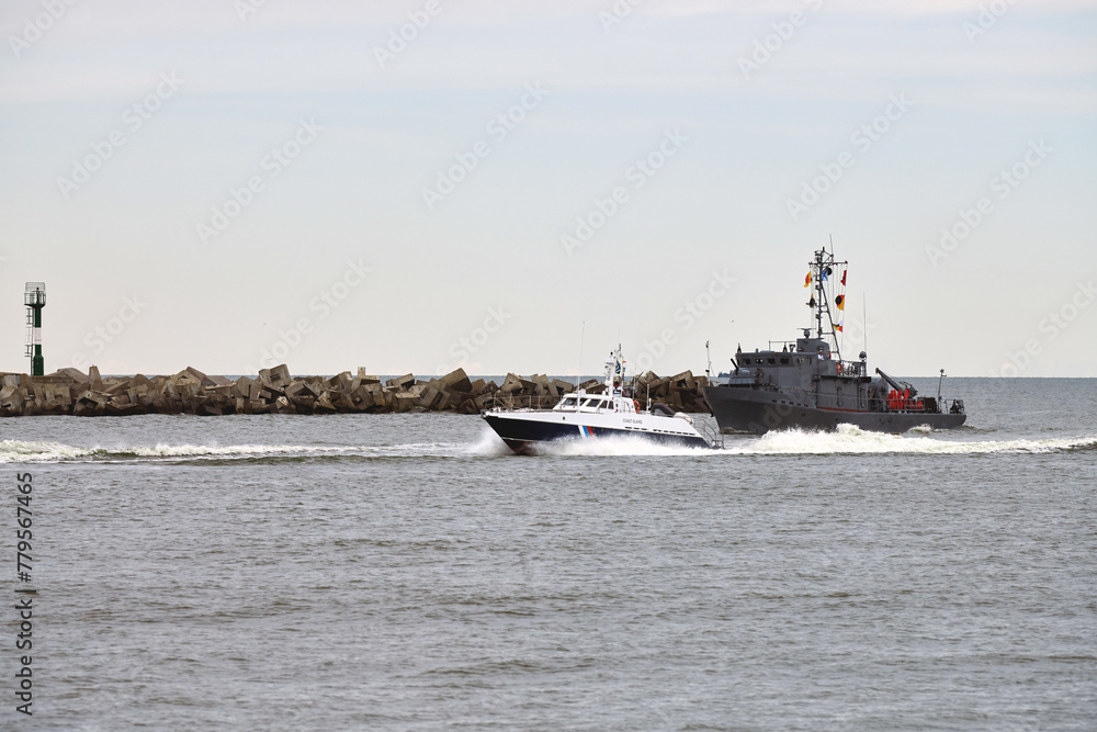 Coast guard ship escort russian warship that has trespassed state ...