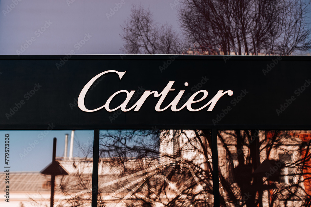 Outdoor facade entrance of boutique Cartier, golden logotype, fine ...