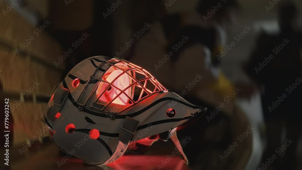 Vidéo Stock Ice hockey goalkeeper goaltender mask helmet with red glow ...