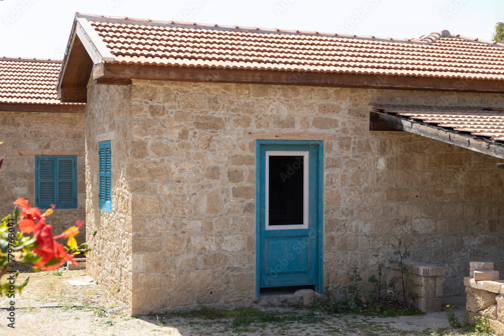 Paphos, Cyprus. 31 March, 2024: Rustic Stone House with Blue Accents In ...