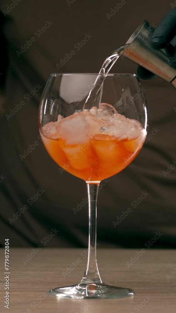 Long fizzy drink in club. Cooking an Aperol Spritz Cocktail. Close up ...