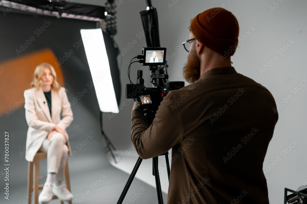 Man captures woman in film studio set. Stock Photo | Adobe Stock