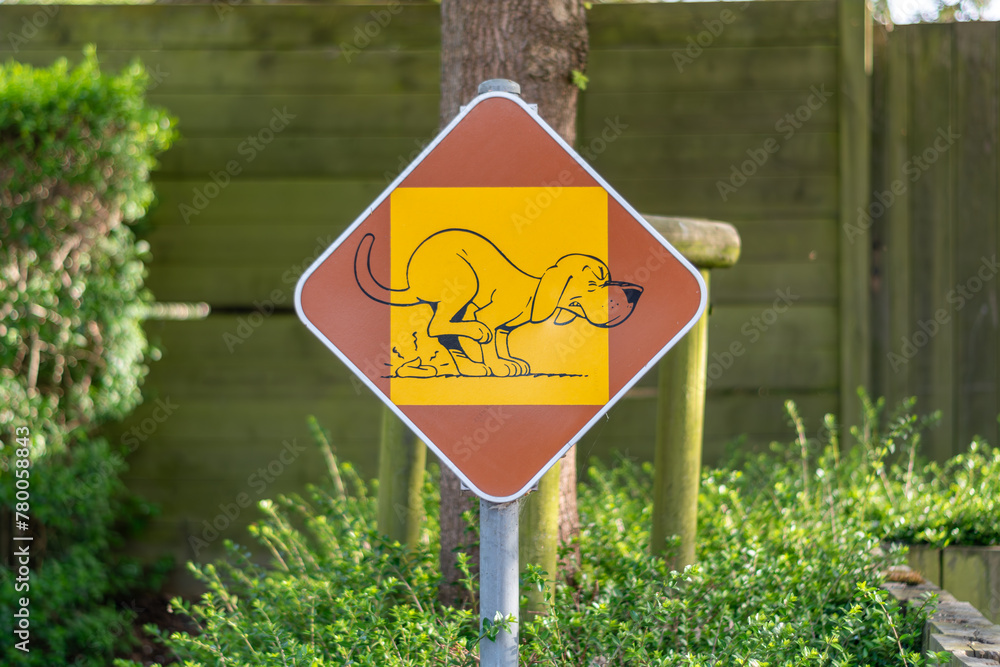 Signs for dog owners in a park,A sign informs about the rules, A sign ...