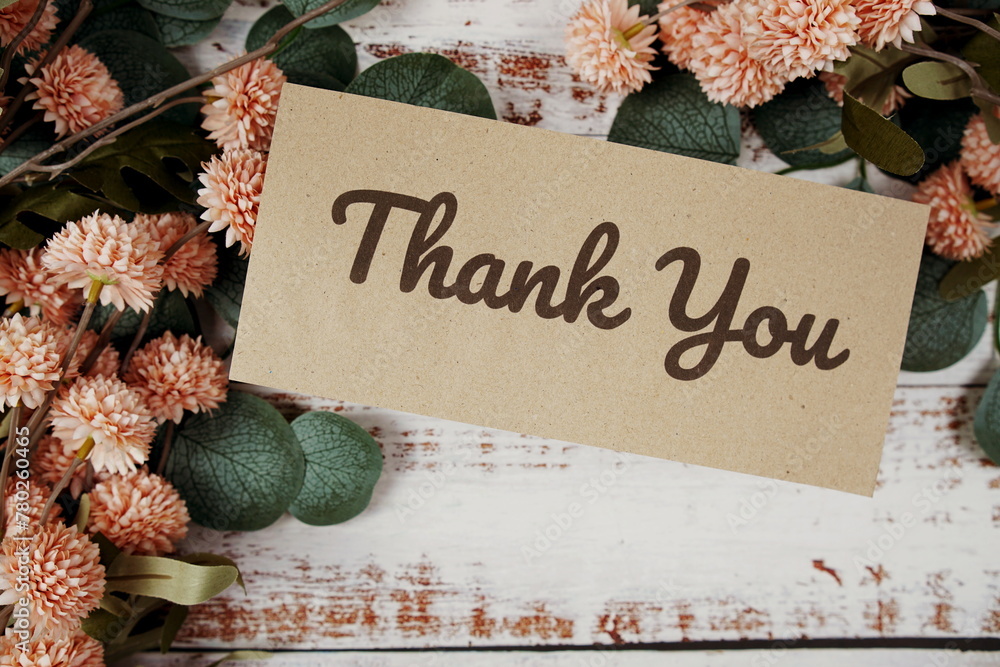 Thank You text message on paper card with flowers border frame on ...