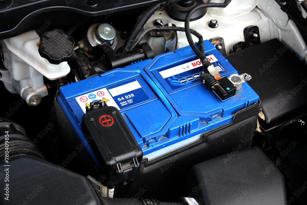 Vinnytsia, Ukraine; April 05, 2024. Blue Varta battery under the hood ...