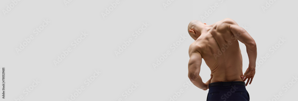 Banner. Rear view photo of bald man showing his muscular back against ...
