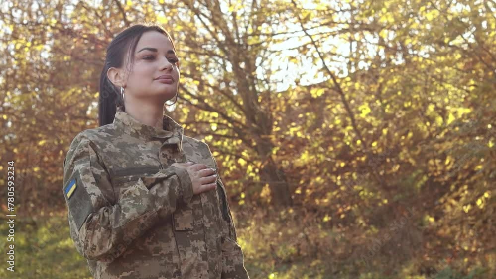 Vidéo Stock Female servicewoman brave soldier dressed in the camouflage ...
