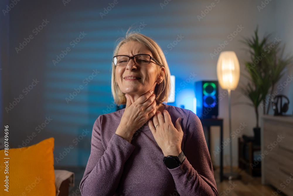 Woman thyroid gland control. Senior lady sweeping the laryngeal ...