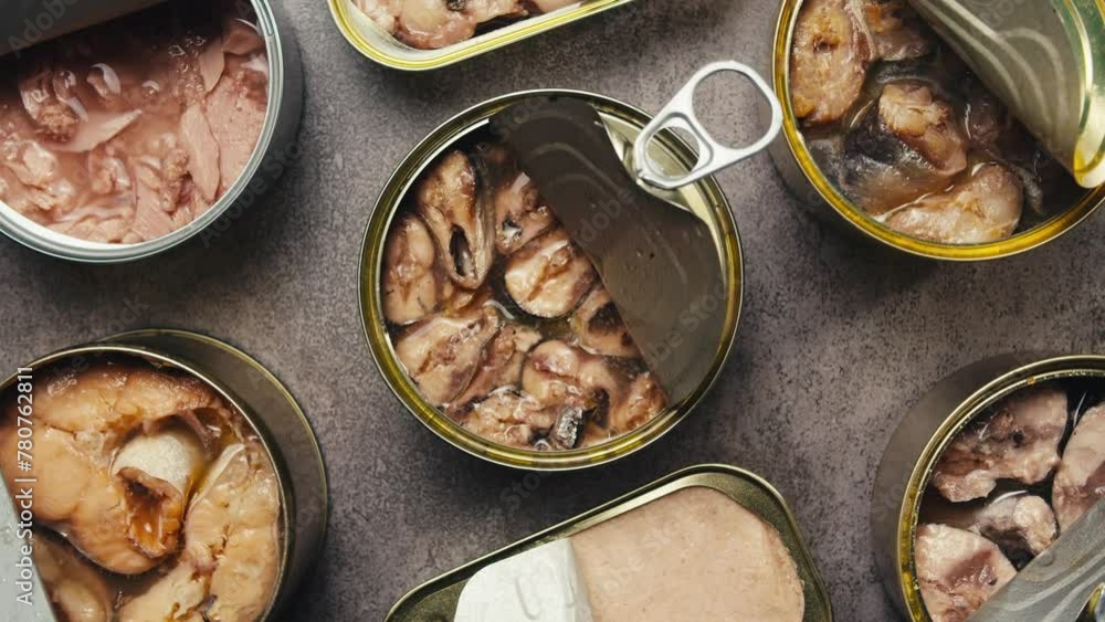 Video „Opening metal cans with canned fish and pate on table top view ...