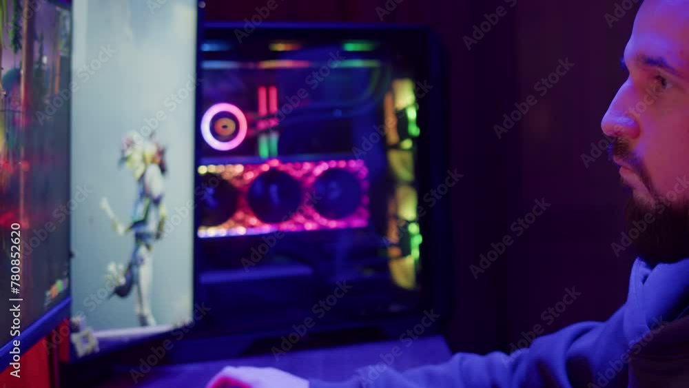Portrait of young man looking at computer close-up .Gamer playing video ...