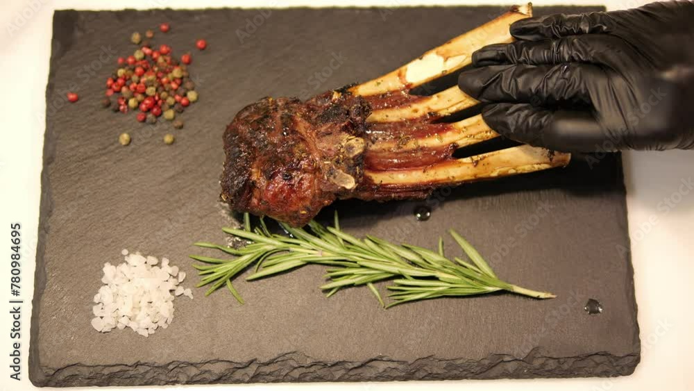 Watch as chef serves sizzling barbecued ribs presenting display of rib ...