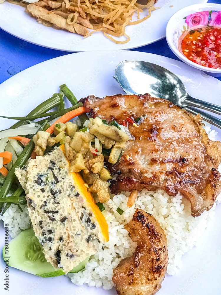 Com tam. Grilled pork over broken rice. A typical Vietnamese breakfast ...