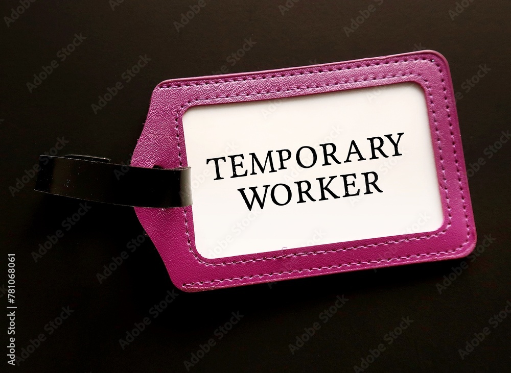 Purple ID card with position title TEMPORARY WORKER, worker - refers to ...