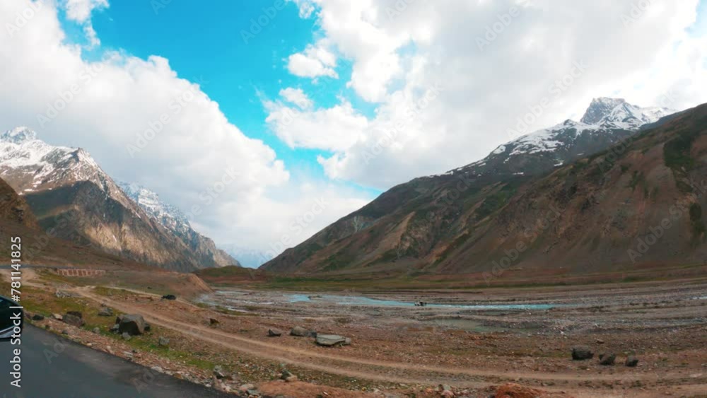 4K shot of Himalaya mountains and Spiti river. View from moving car ...