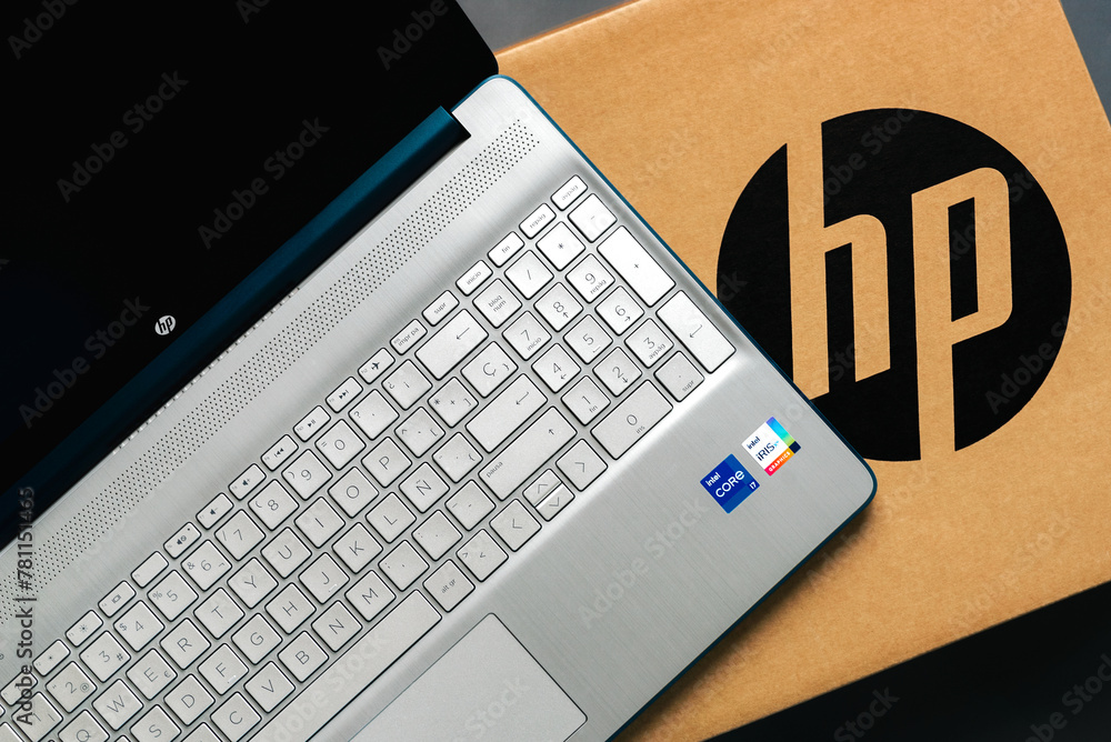 Laptop computer HP on top of the cardboard box with the HP logo ...