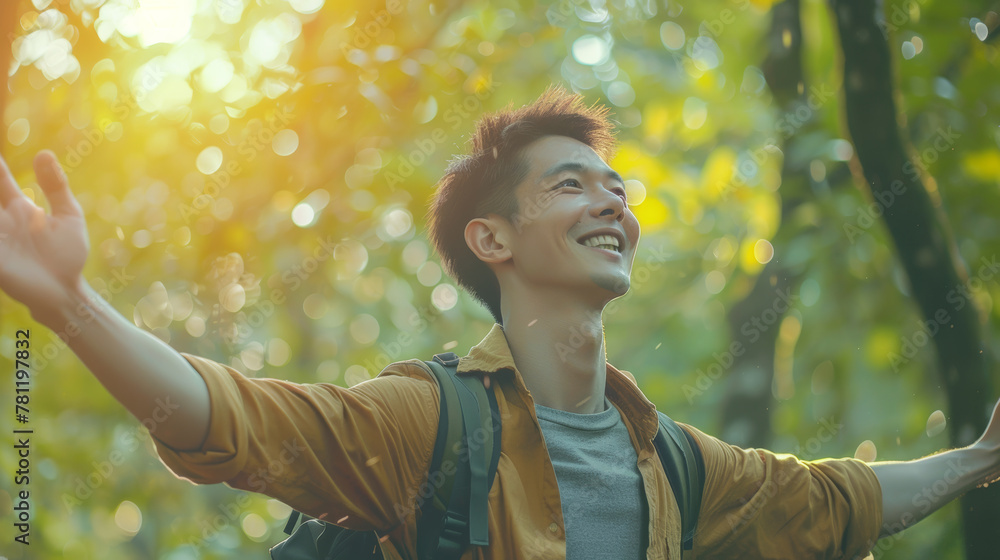Portrait of a free happy Asian man with open arms enjoying life in ...