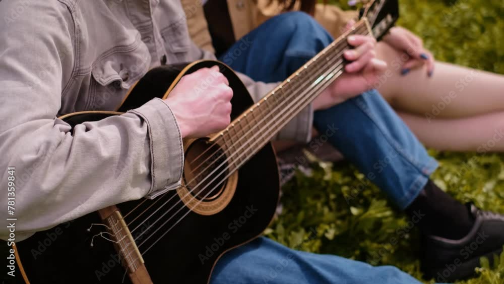 Outdoor music festival featuring a man playing guitar at a camping site ...