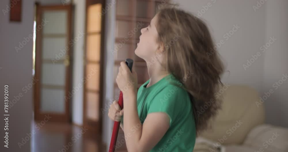 Creative Teenage Girl Singing and Using Broom Handle as Microphone ...