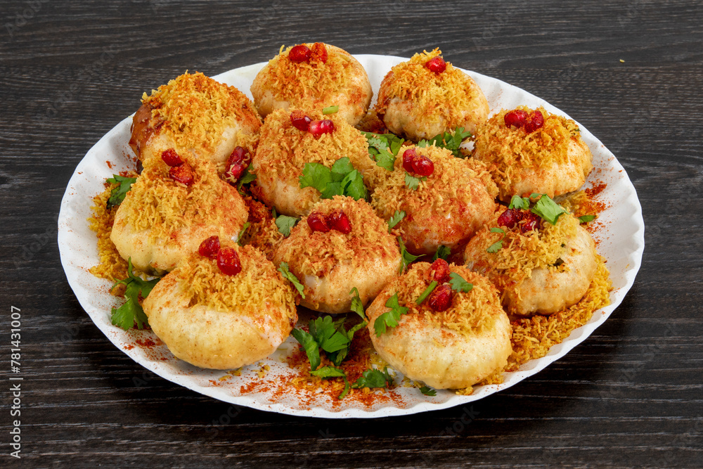 A plate of traditional Indian or Pakistani appetizer Dahi Puri, crispy ...