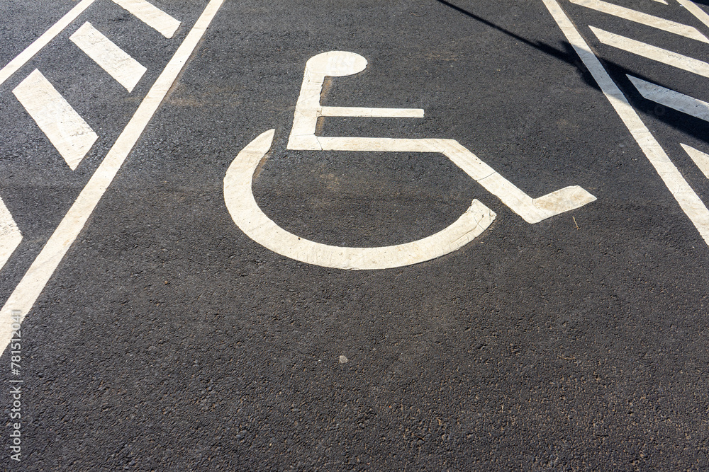 Disabled parking sign painted on ground. Symbol indicating reserved ...