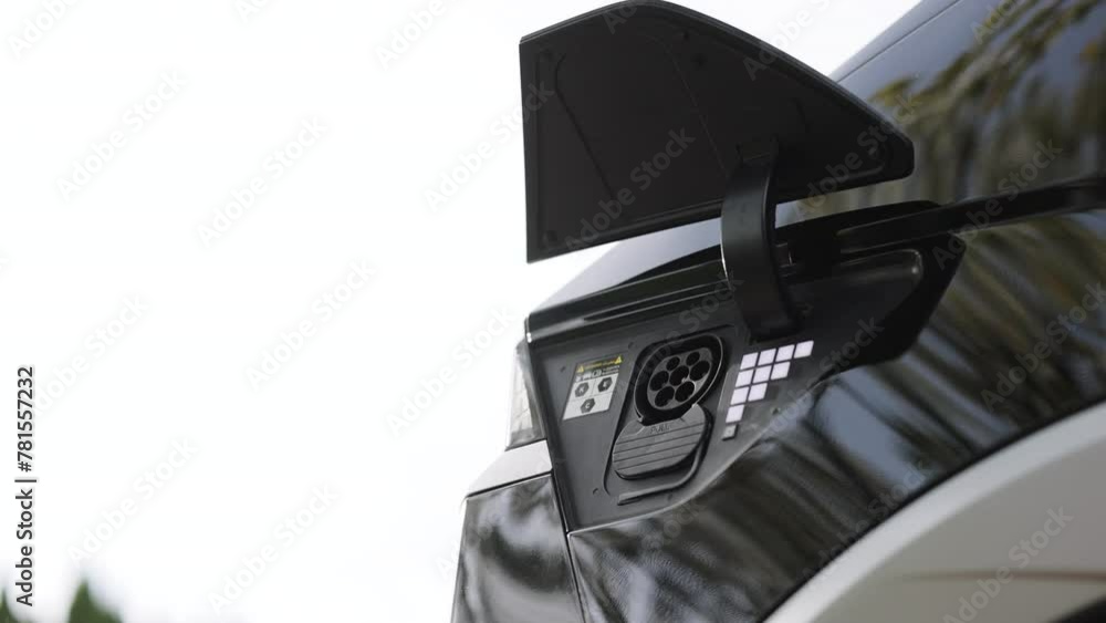 Type 2 CCS Combo plug port on electric vehicle. Fast charging socket ...