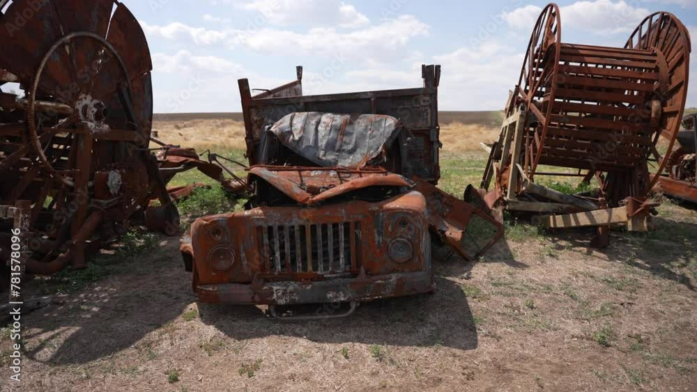 Traces of war: destroyed agricultural machinery. Fire-burnt shots of ...