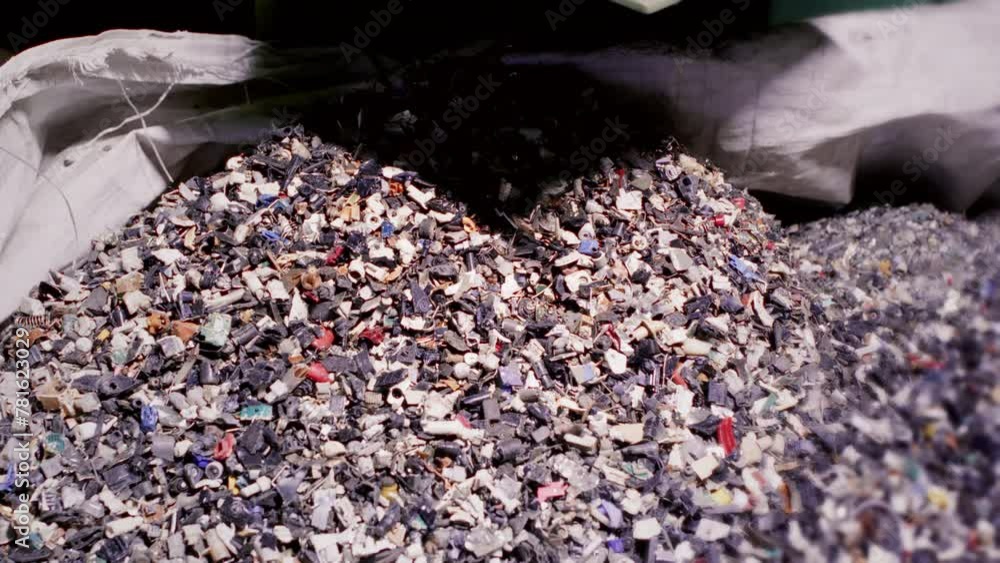 Man takes the plastic particles with his palms. Male pours out blanks ...