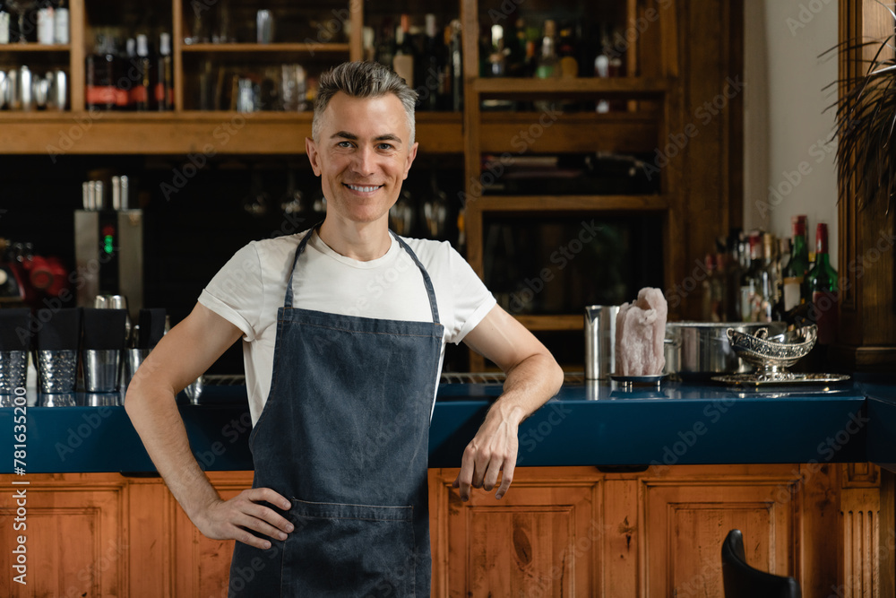 Small business concept. Mature handsome man cafe waiter standing near ...