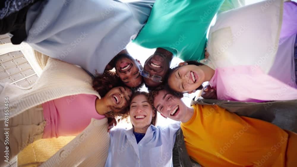 Low angle of a group of multiracial community young friends wearing ...