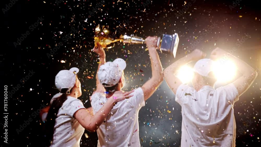 Team of four young winners together celebrates success and jump for joy ...