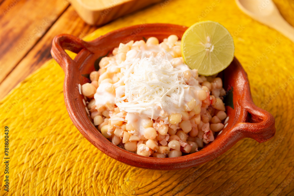 Esquites. Corn kernels cooked and served with mayo, sour cream, lemon ...
