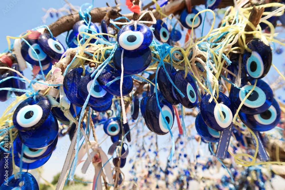 Close up on the many blue glass eyes hanging from the evil eye tree ...