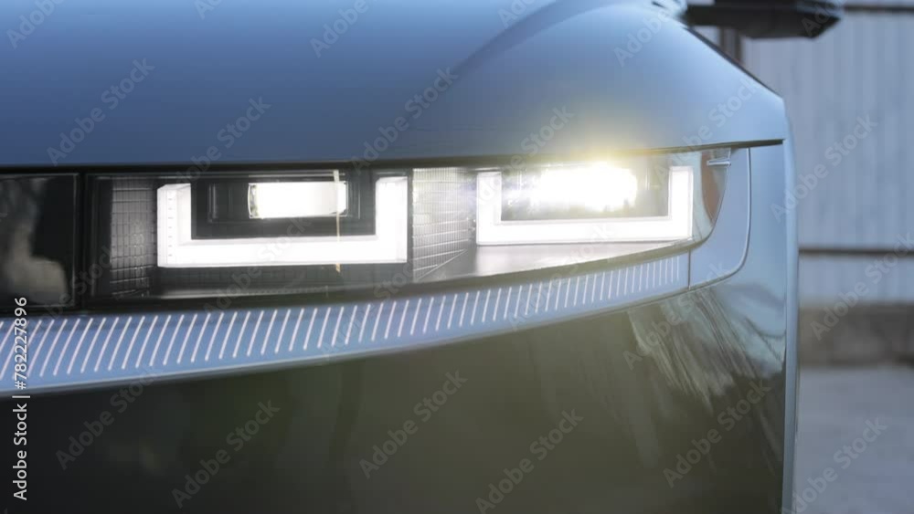 Modern car headlamp flashing light with blinking on continuously ...