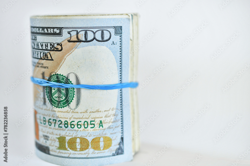 Large roll of money secured with a rubber band, wad of cash Stock Photo ...