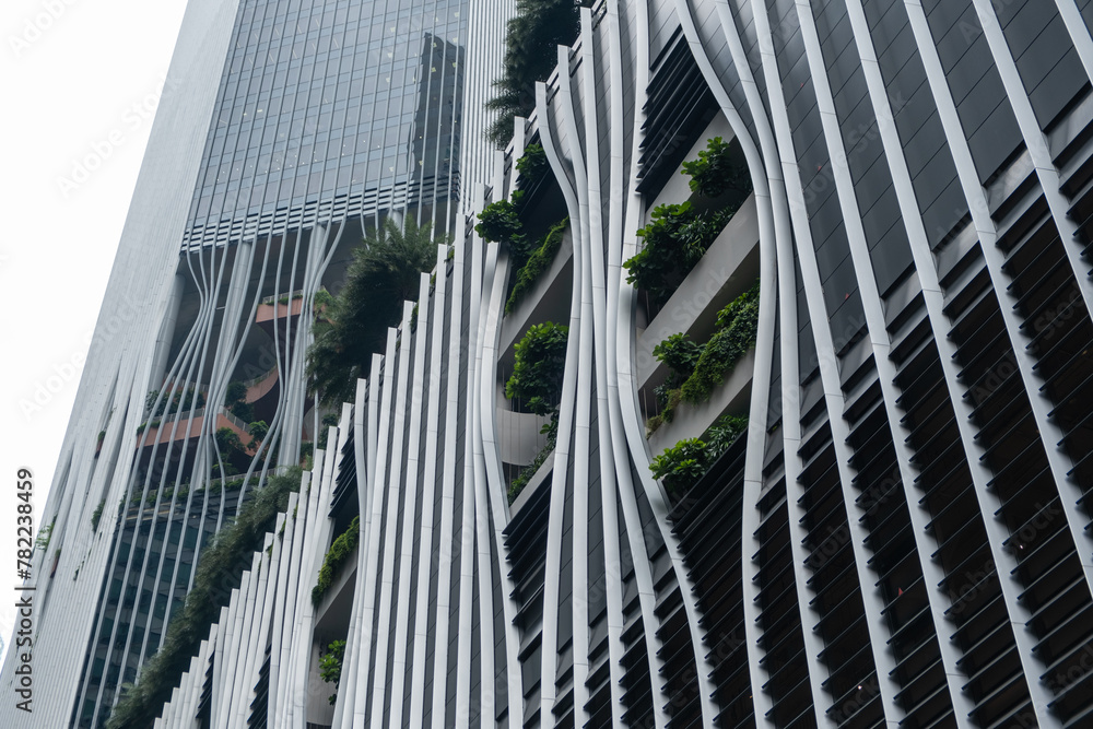 Singapore - 8 March 2024: Façade exterior of CapitaSpring Building. It ...