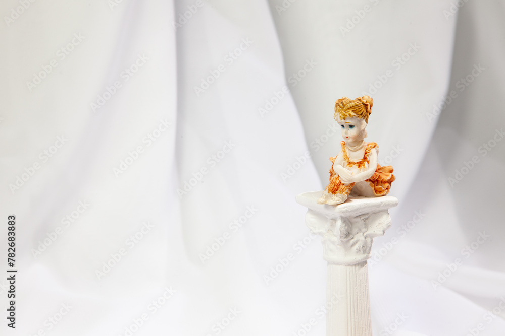 Vintage plaster doll of ballerina sitting on top of white plaster piece ...
