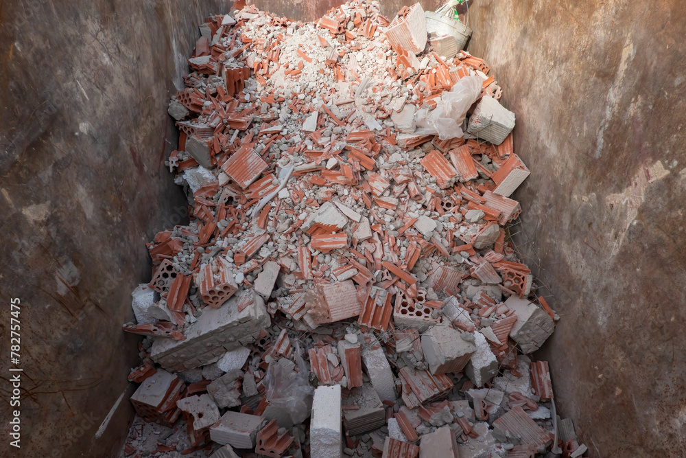 The inside of the old steel container is filled with construction ...