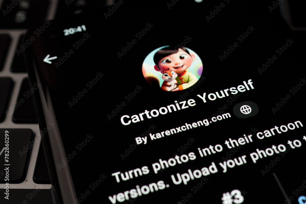 CARTOONIZE YOURSELF custom GPT seen in GPT Store on the screen of smartphone placed on laptop ...